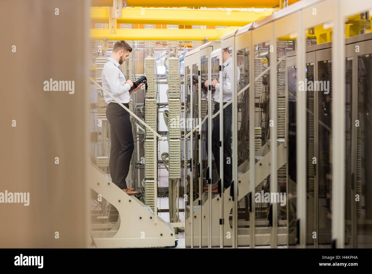 Technician using digital cable analyzer Stock Photo - Alamy