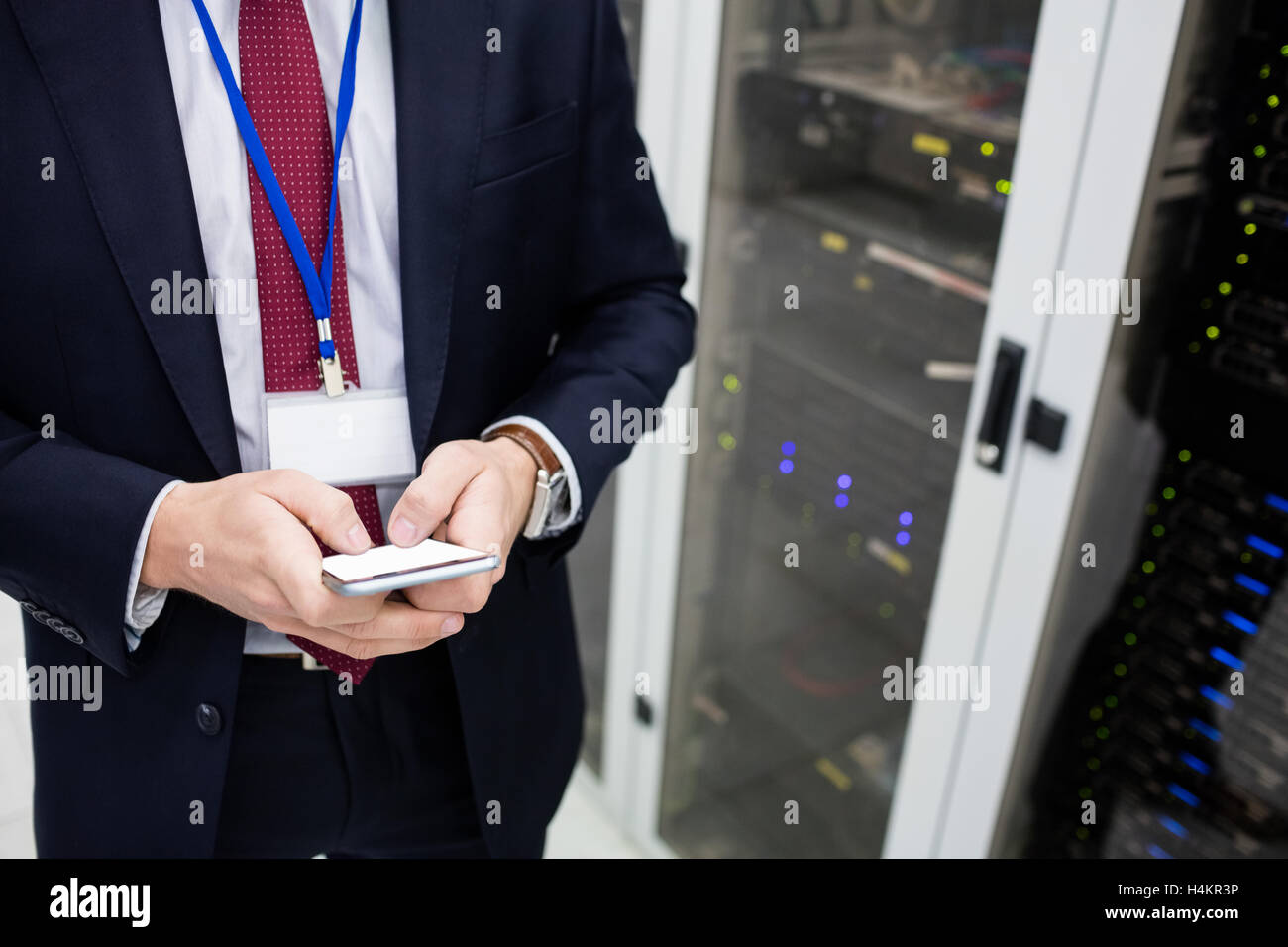 Technician using mobile phone Stock Photo - Alamy