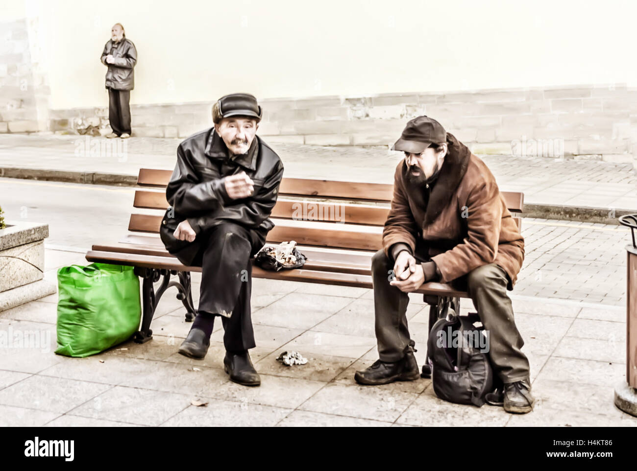 Two homeless men on street at cloudy autumn day Stock Photo - Alamy