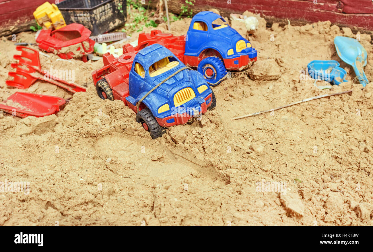 Forgotten of childhood cars in sandbox at summer day Stock Photo - Alamy