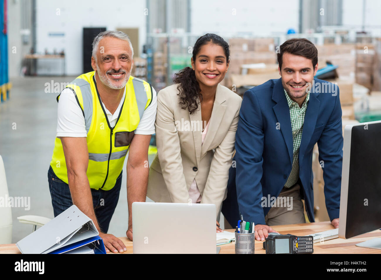 Portrait of warehouse managers and worker working together Stock Photo ...