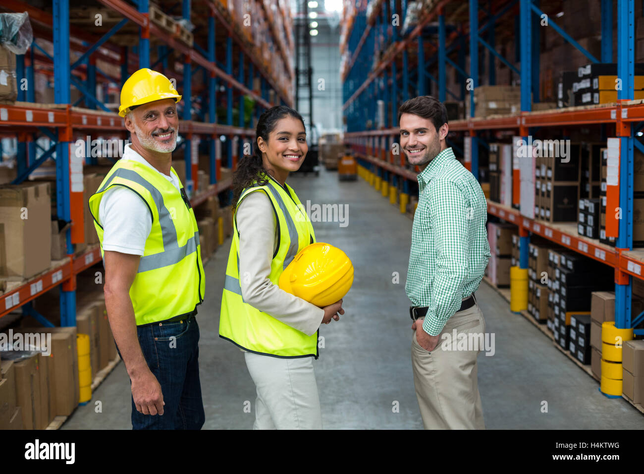 Portrait of warehouse team standing together Stock Photo - Alamy