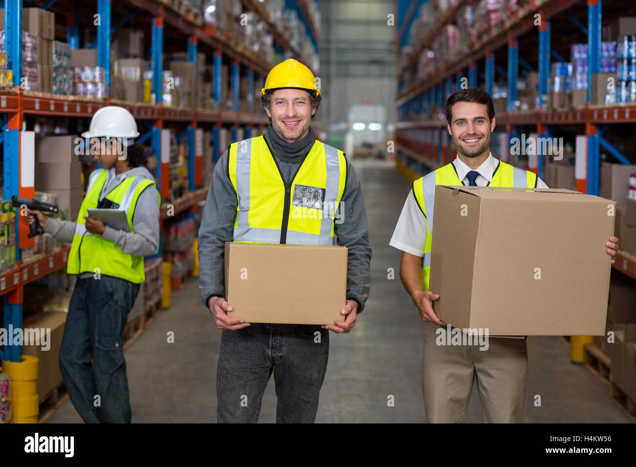 Portrait of warehouse worker standing together Stock Photo - Alamy