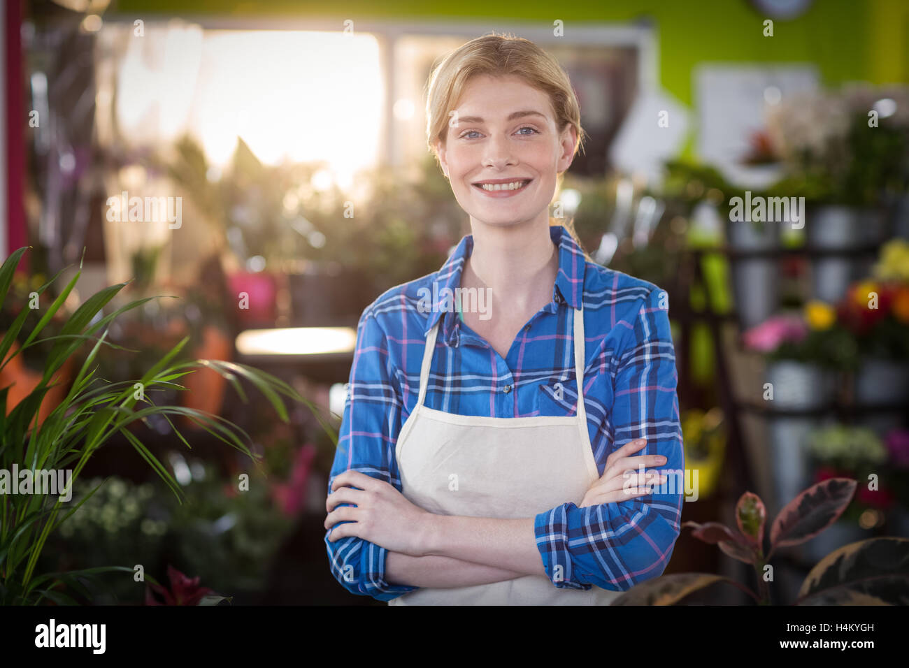 Portrait of female florist smiling Stock Photo - Alamy