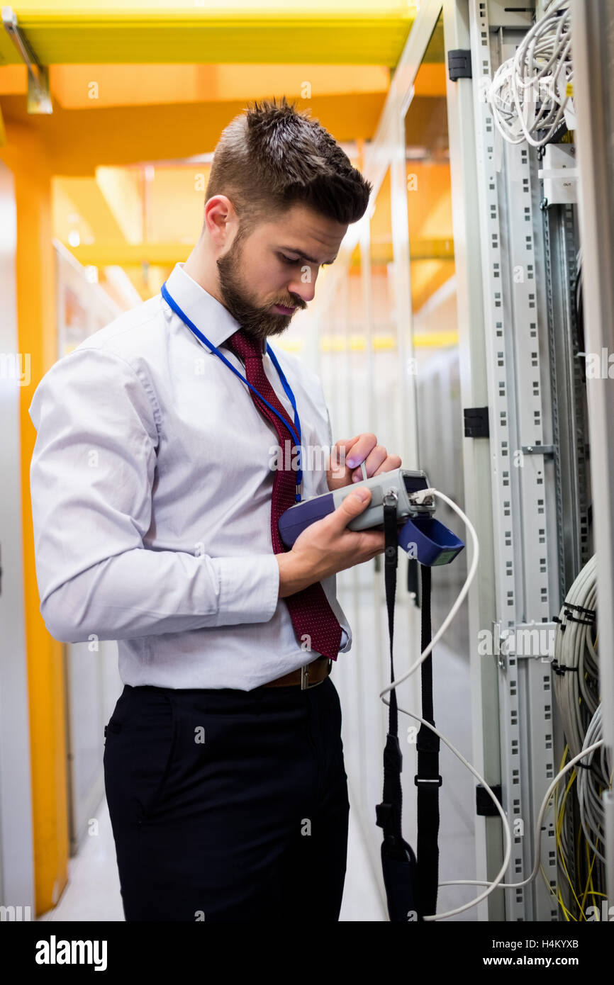 Technician using digital cable analyzer Stock Photo - Alamy