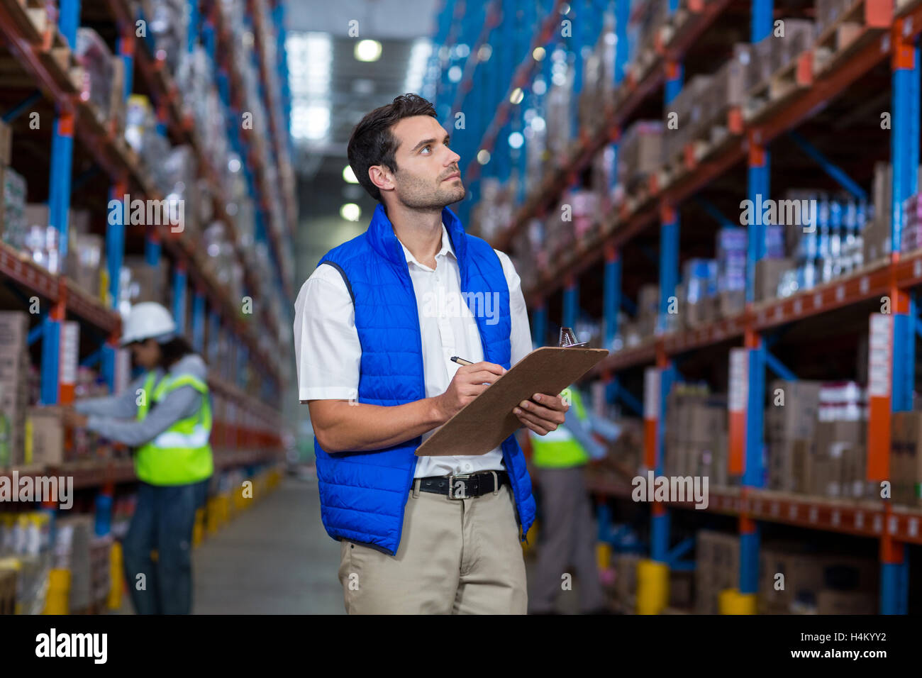 Worker writing hi-res stock photography and images - Alamy