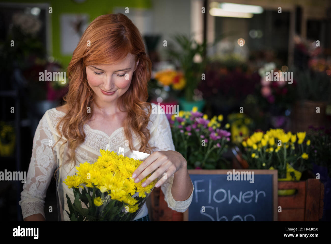 Female florist holding flower hi-res stock photography and images - Alamy