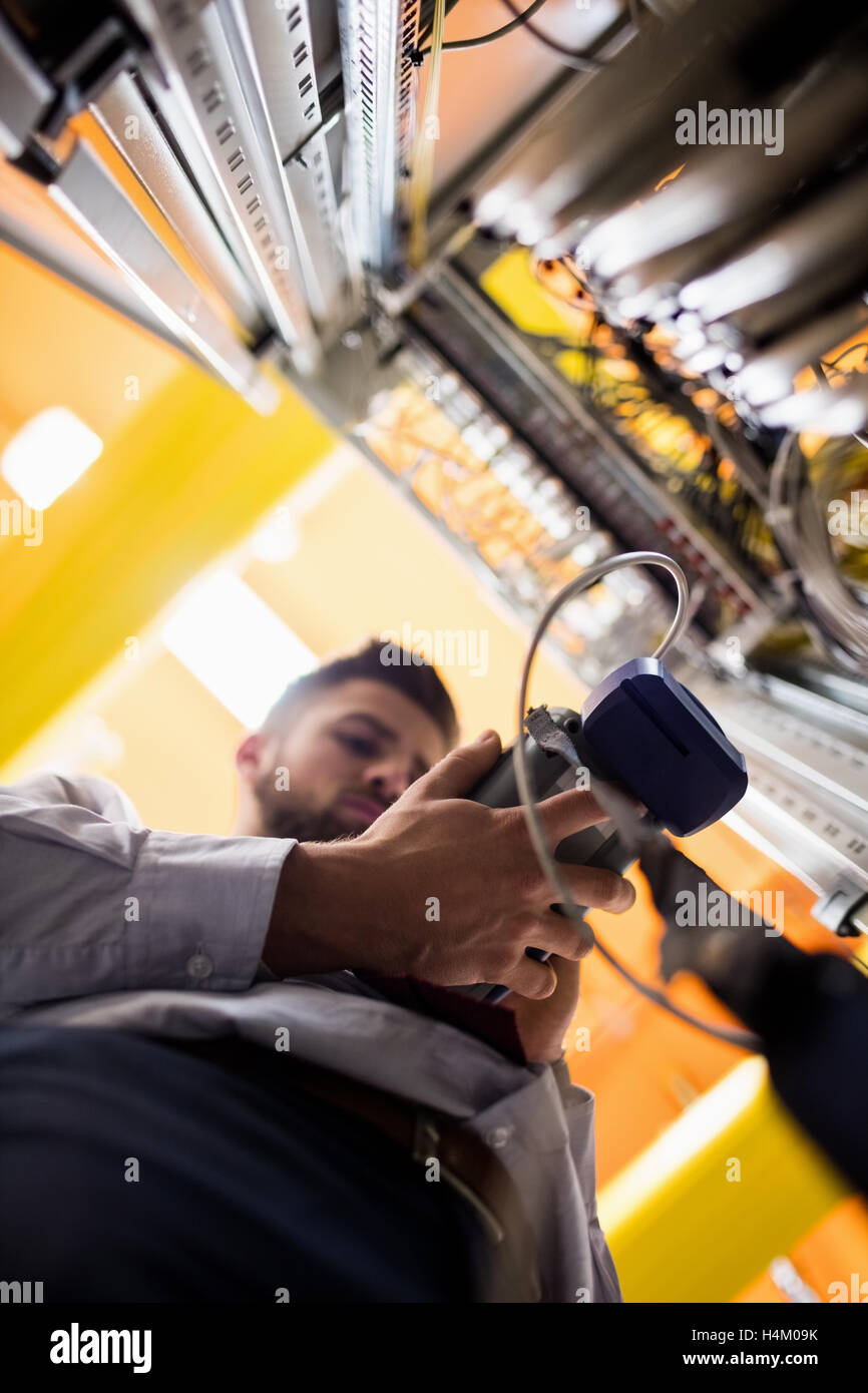 Technician using digital cable analyzer Stock Photo - Alamy