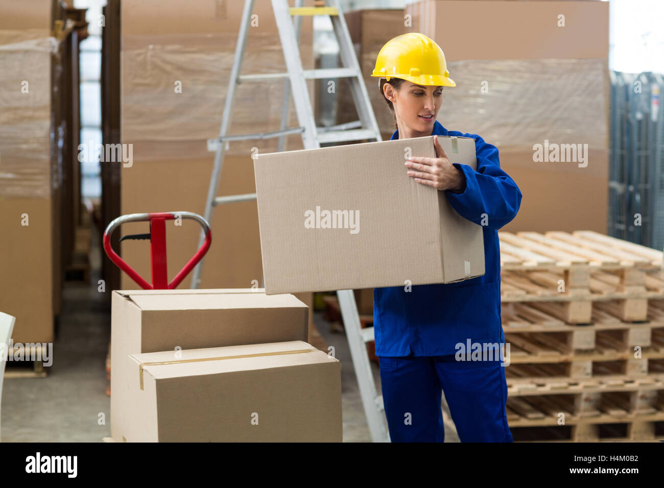 Worker unloading boxes hi-res stock photography and images - Alamy