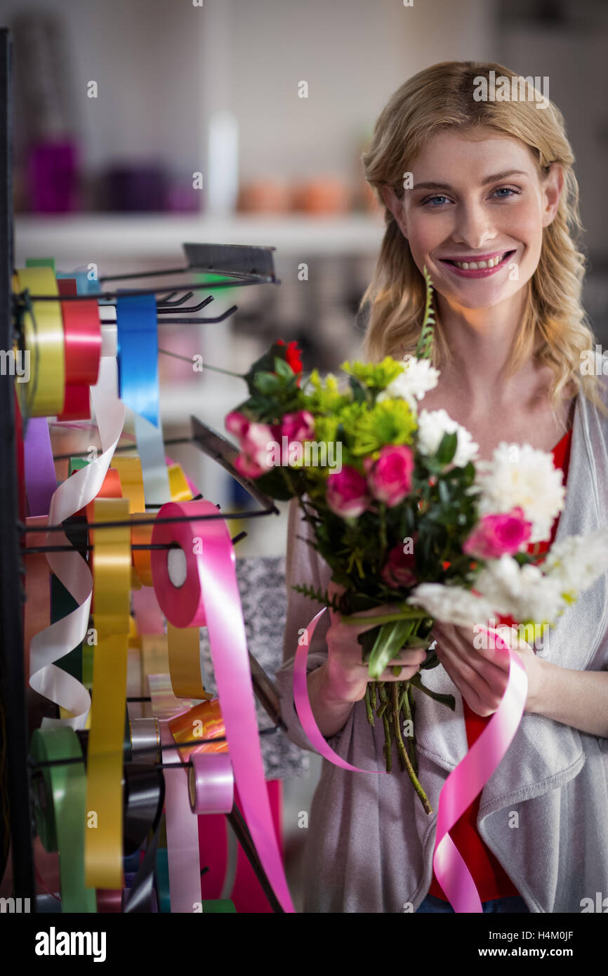 Female florist preparing a flower bouquet Stock Photo - Alamy