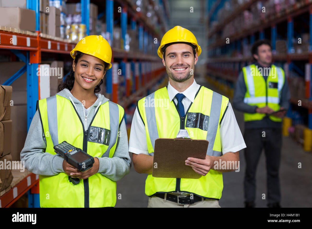 Portrait of warehouse worker standing together Stock Photo - Alamy