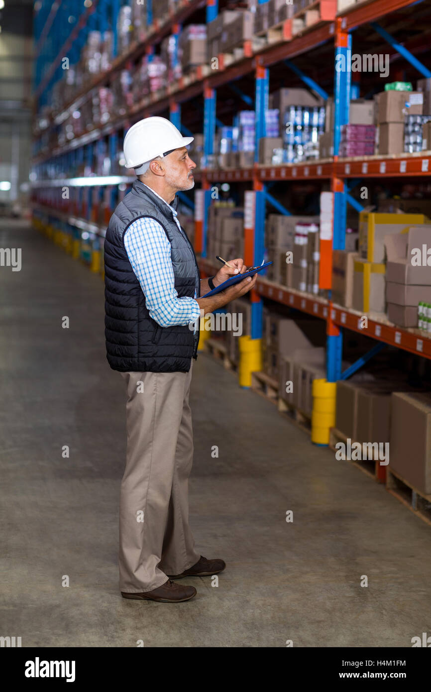 Warehouse worker checking the inventory Stock Photo - Alamy Warehouse worker checking the inventory Stock Photo - Alamy