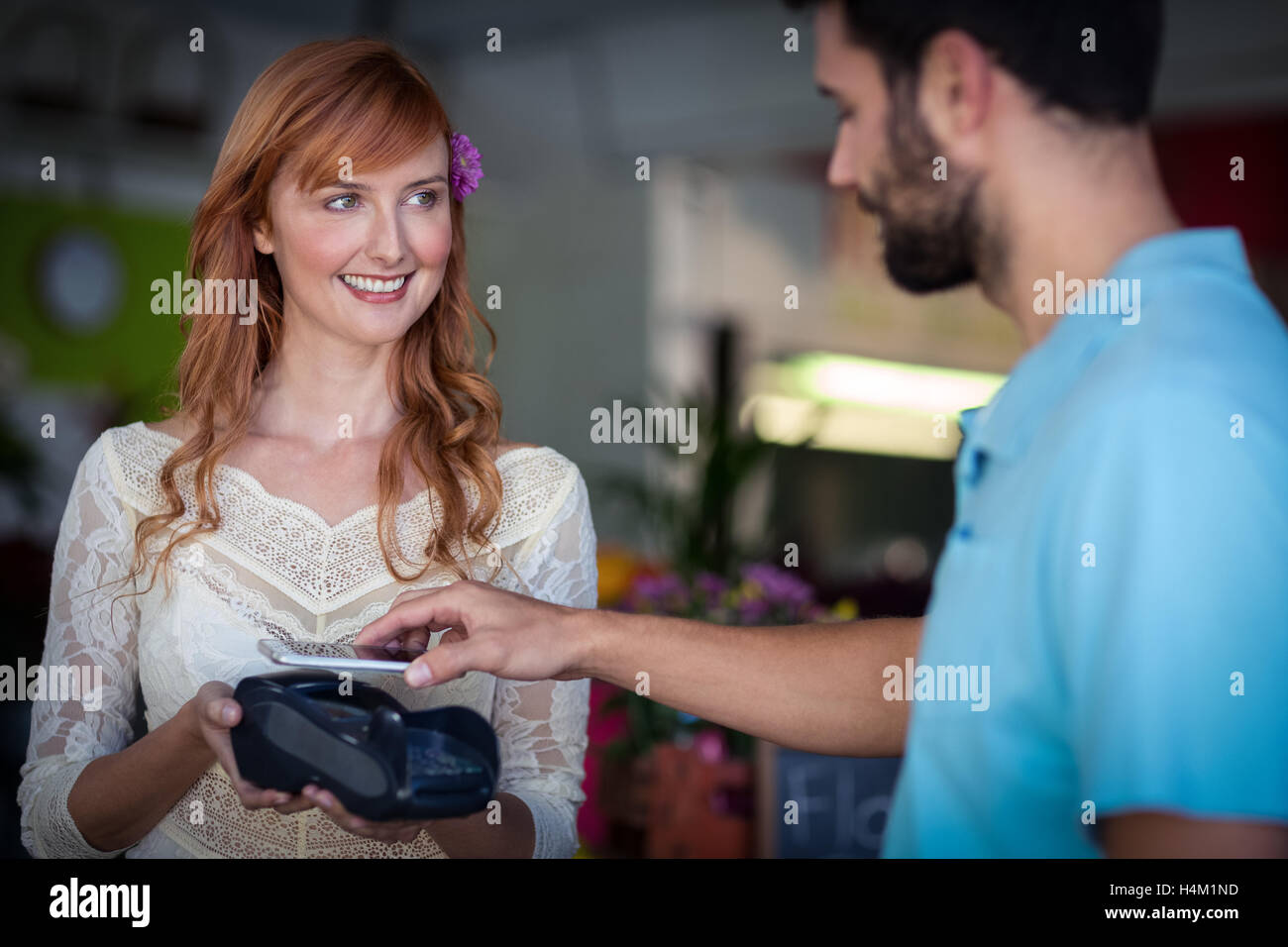 Happy customer making payment hi-res stock photography and images - Alamy