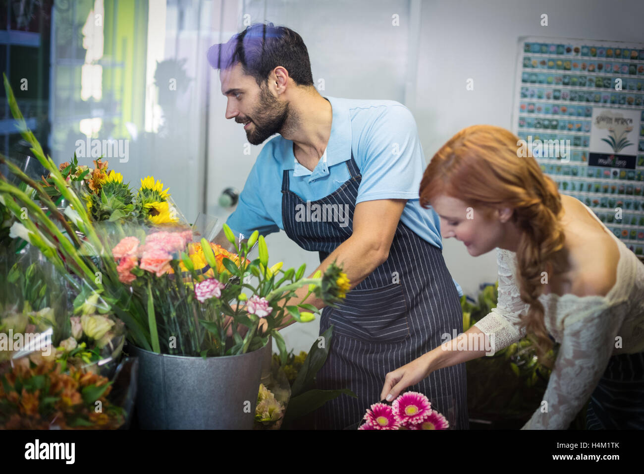 Young woman arranging flower hi-res stock photography and images - Alamy