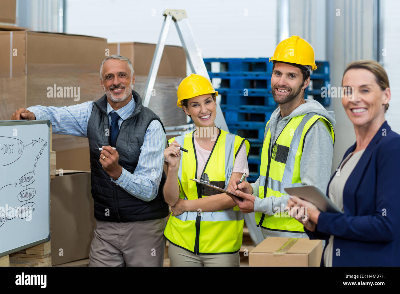 Portrait of warehouse manager and worker standing together Stock Photo ...