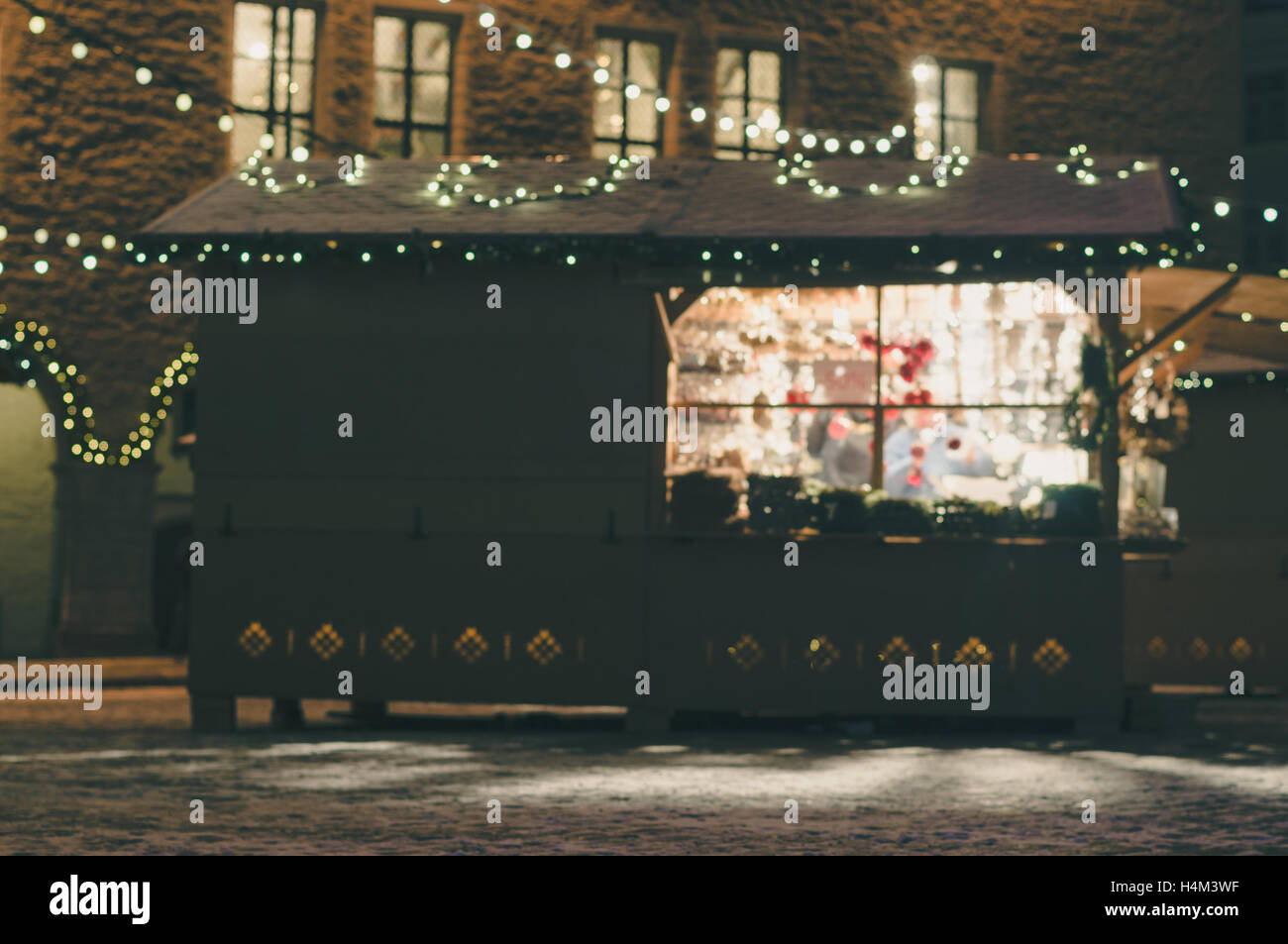 Blurred image of Christmas market, outdoor gift shop. Holiday concept ...