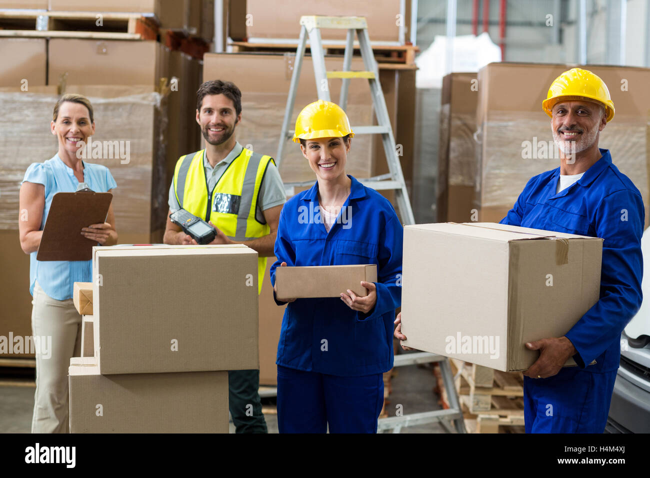 Portrait of warehouse worker standing together Stock Photo - Alamy