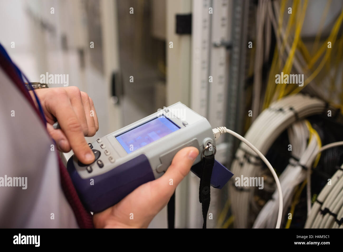 Technician using digital cable analyzer Stock Photo - Alamy