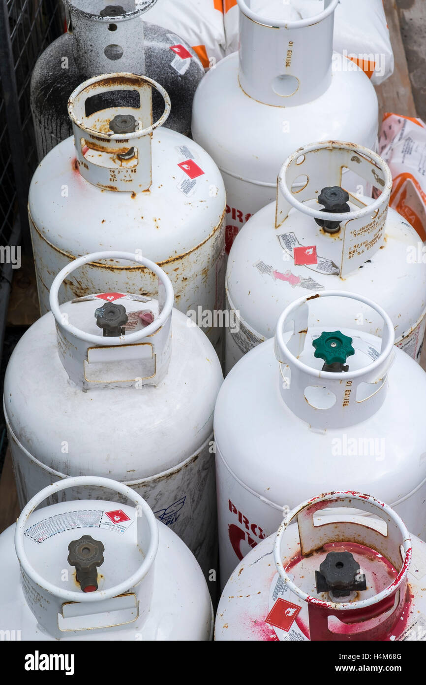 Looking down on white painted propane tanks at a construction site ...