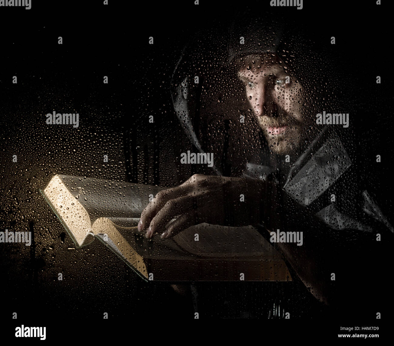 necromancer casts spells from thick ancient book, behind transparent ...