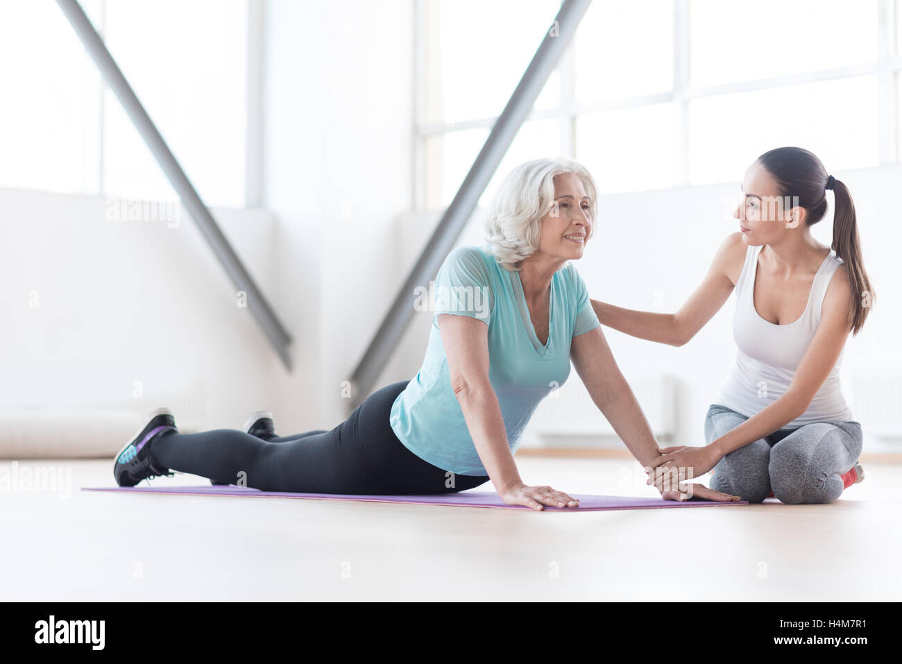 Positive optimistic woman enjoying her physical exercise Stock Photo ...