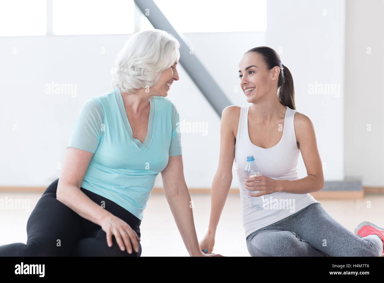 Happy positive women smiling Stock Photo - Alamy
