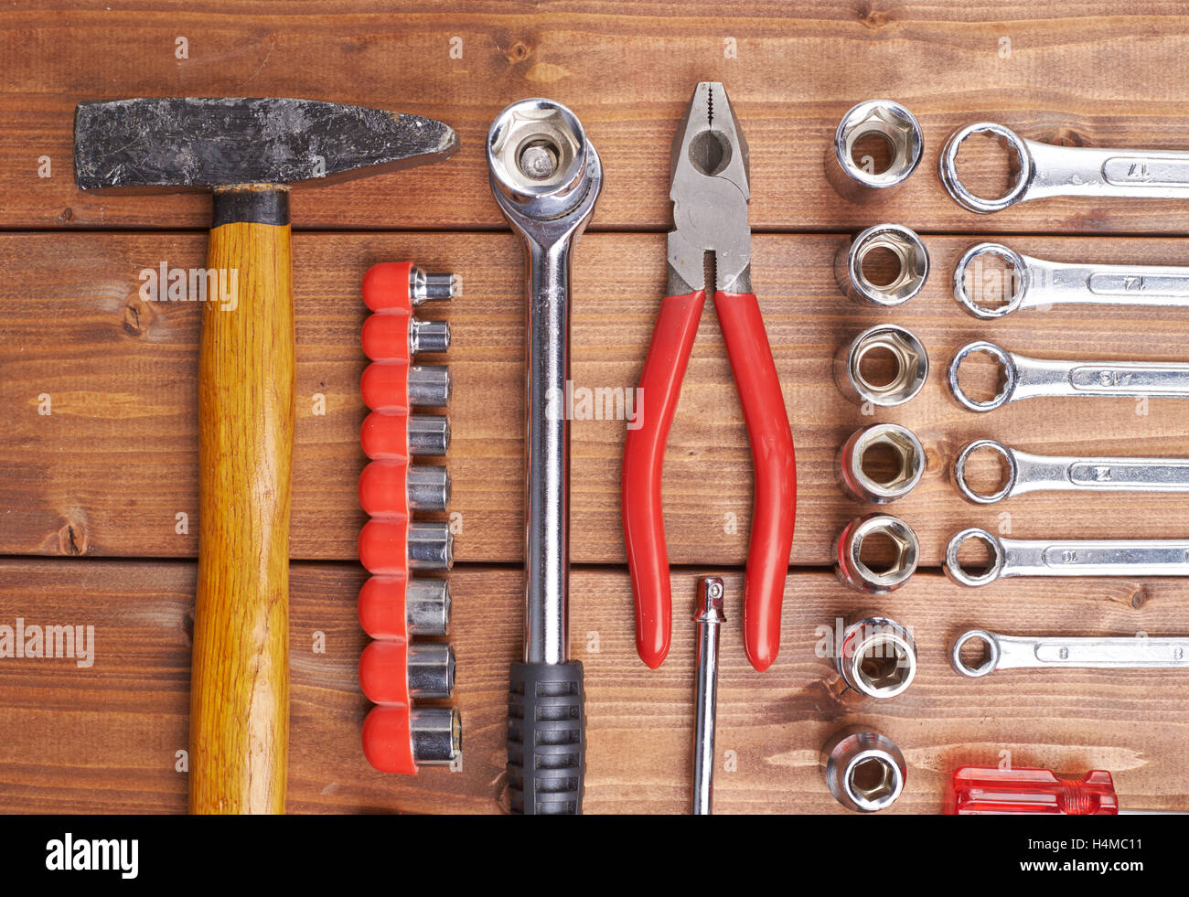Set of different work tools on wooden surface Stock Photo - Alamy