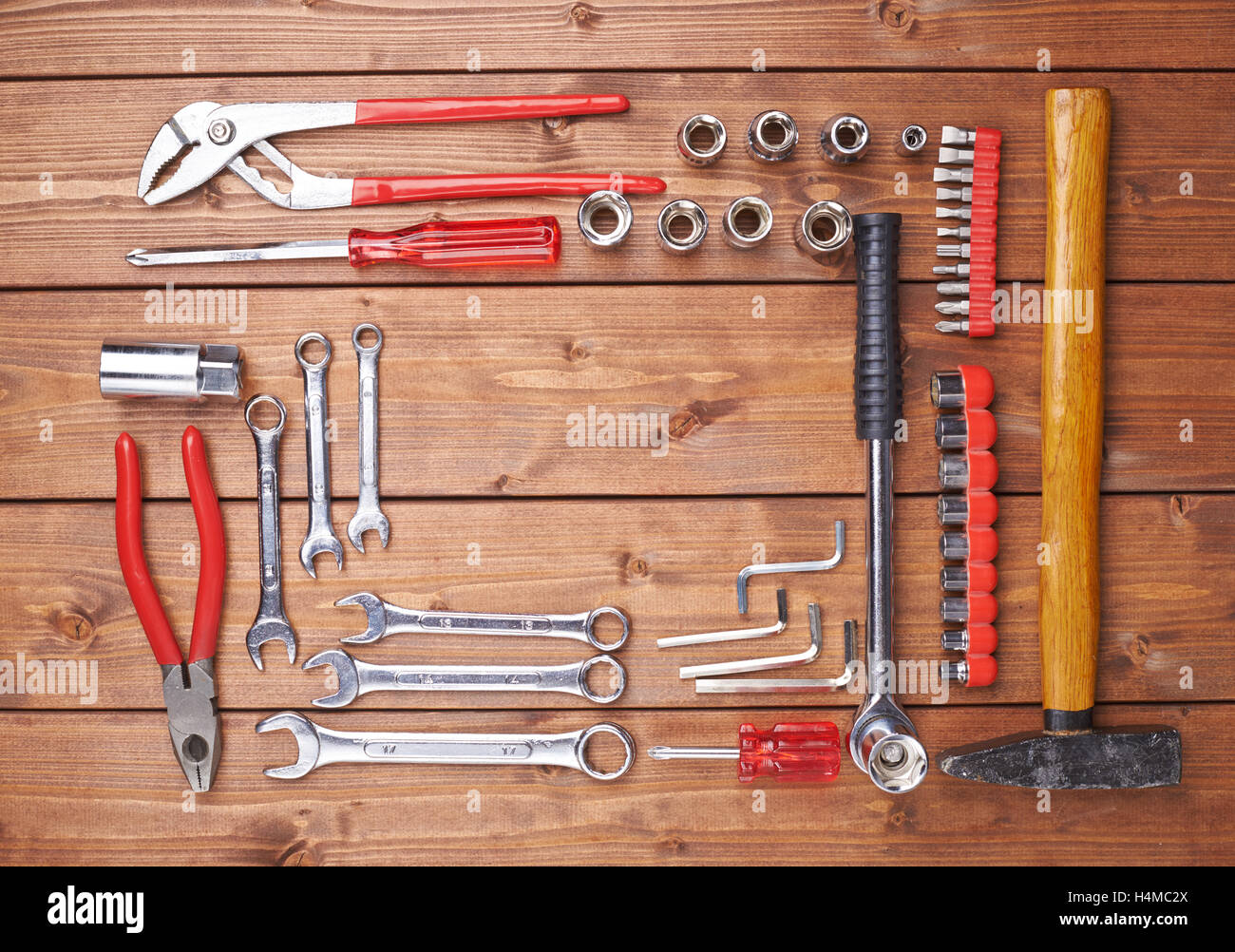 Set of different work tools on wooden surface Stock Photo - Alamy