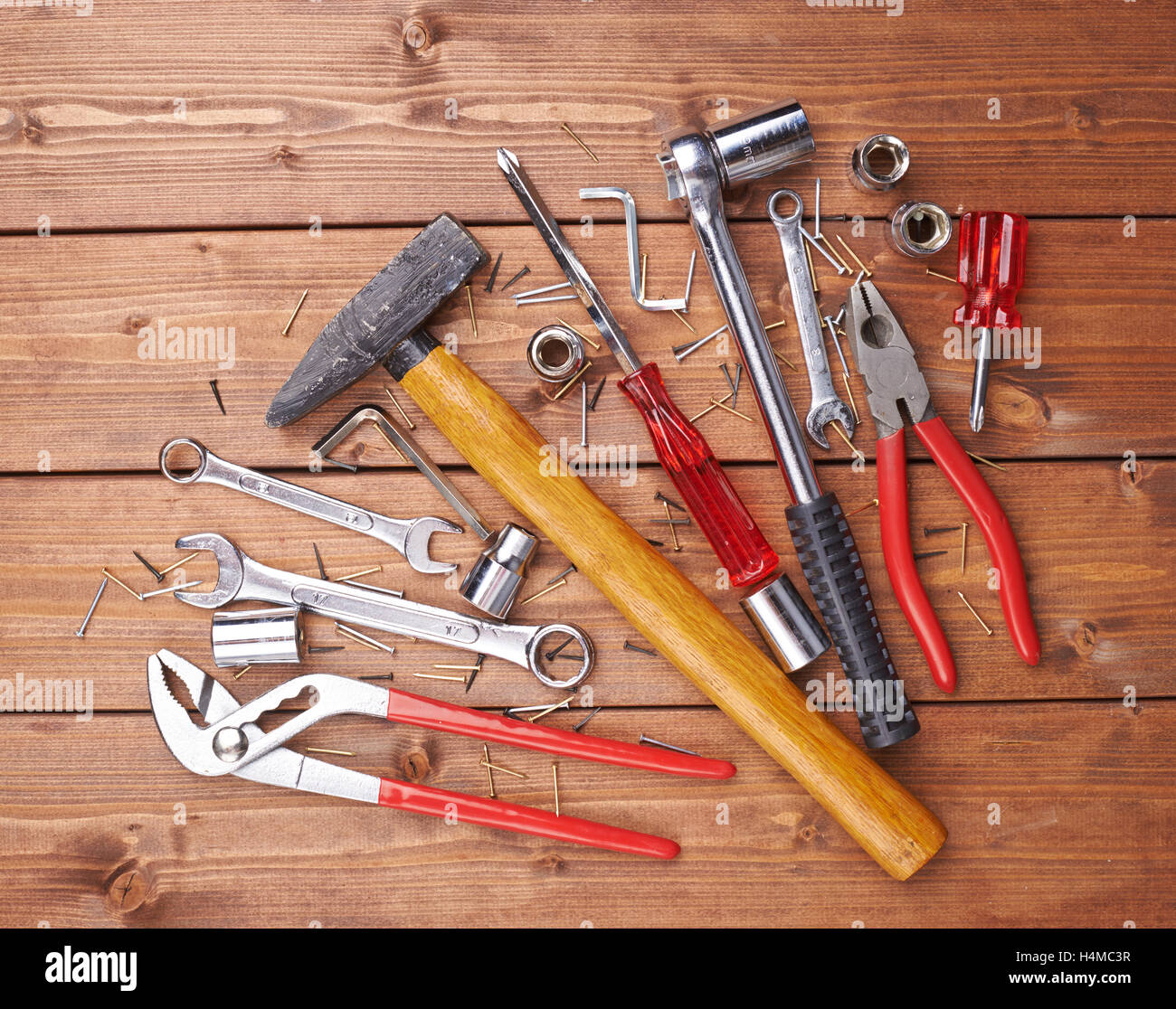 Set of different work tools on wooden surface Stock Photo - Alamy