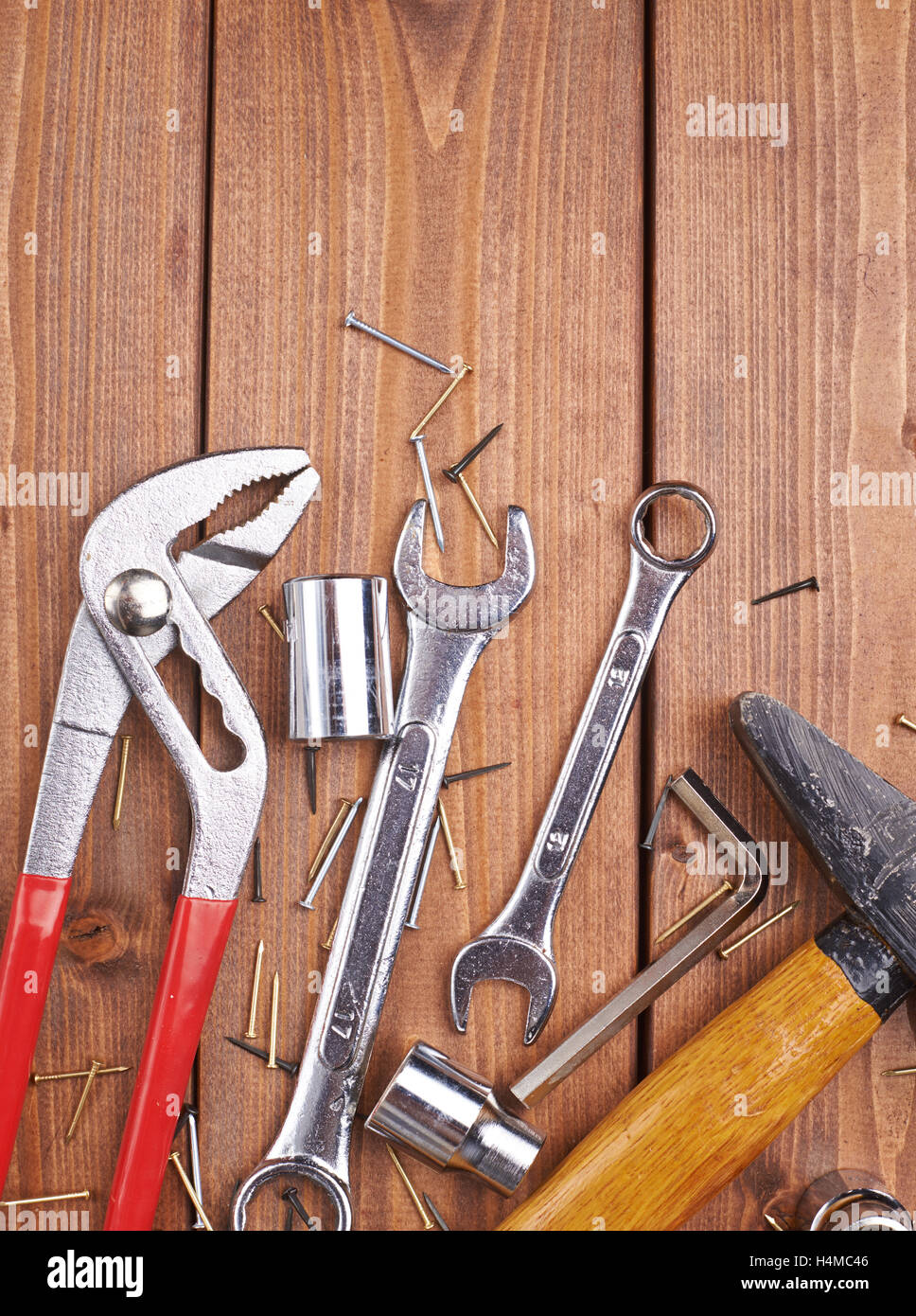 Set of different work tools on wooden surface Stock Photo - Alamy