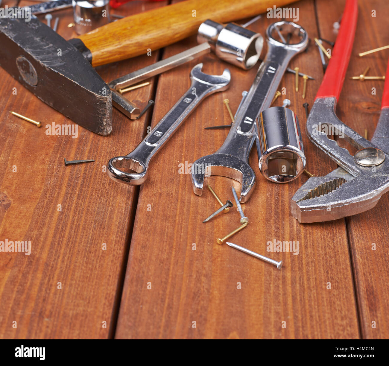 Set of different work tools on wooden surface Stock Photo - Alamy
