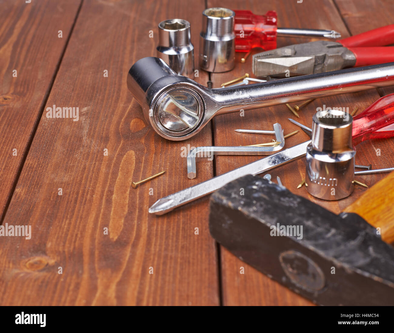 Set of different work tools on wooden surface Stock Photo - Alamy