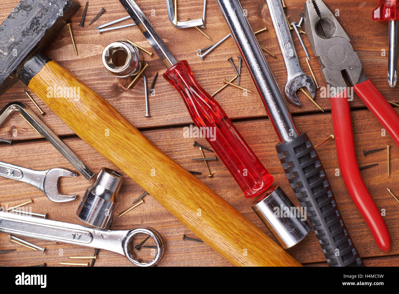 Set of different work tools on wooden surface Stock Photo - Alamy