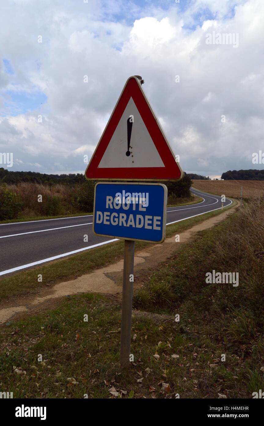 Road sign with an exclamation mark and a rectangle routes to degrade ...