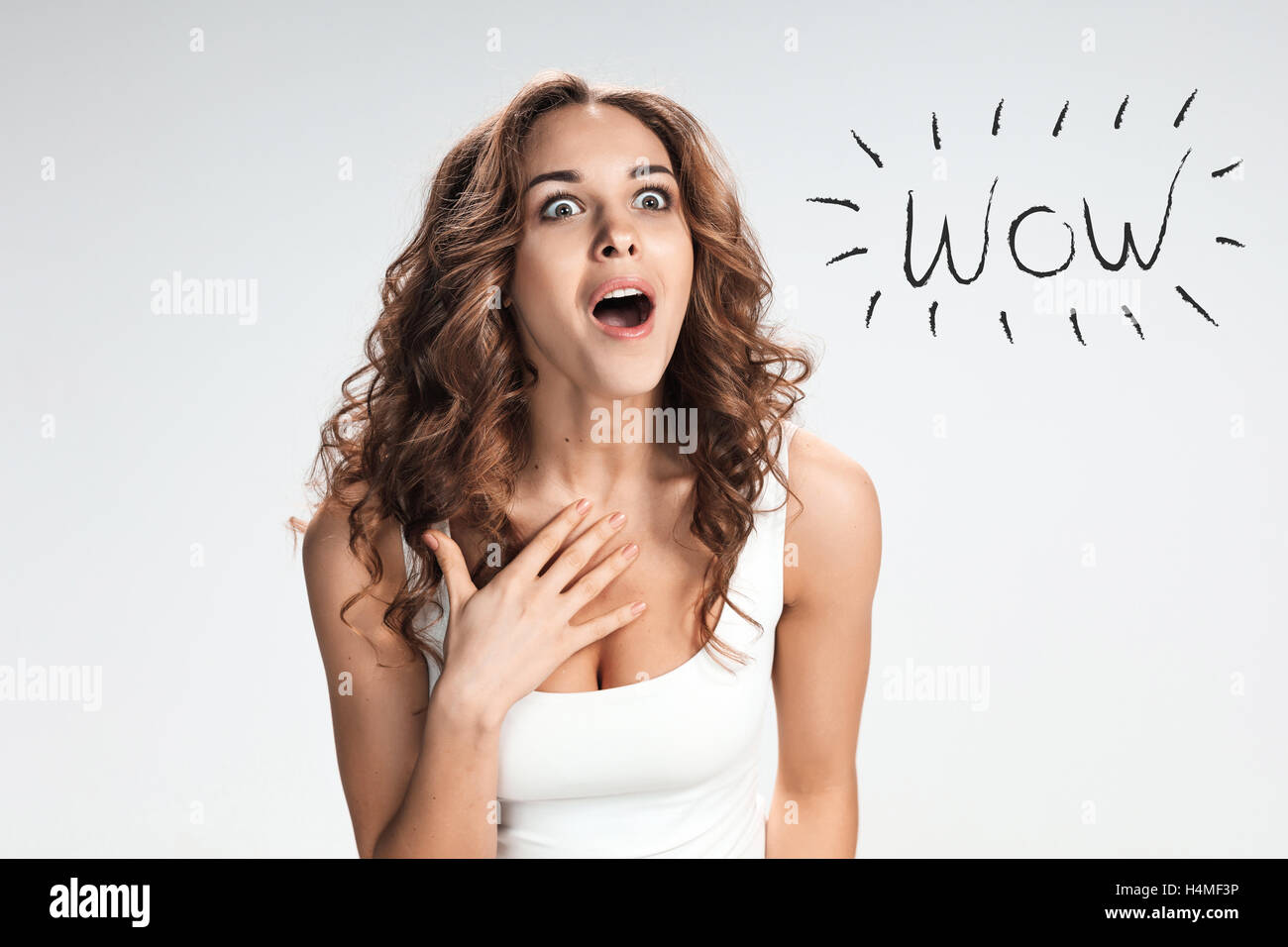 Portrait of young woman with shocked facial expression Stock Photo - Alamy