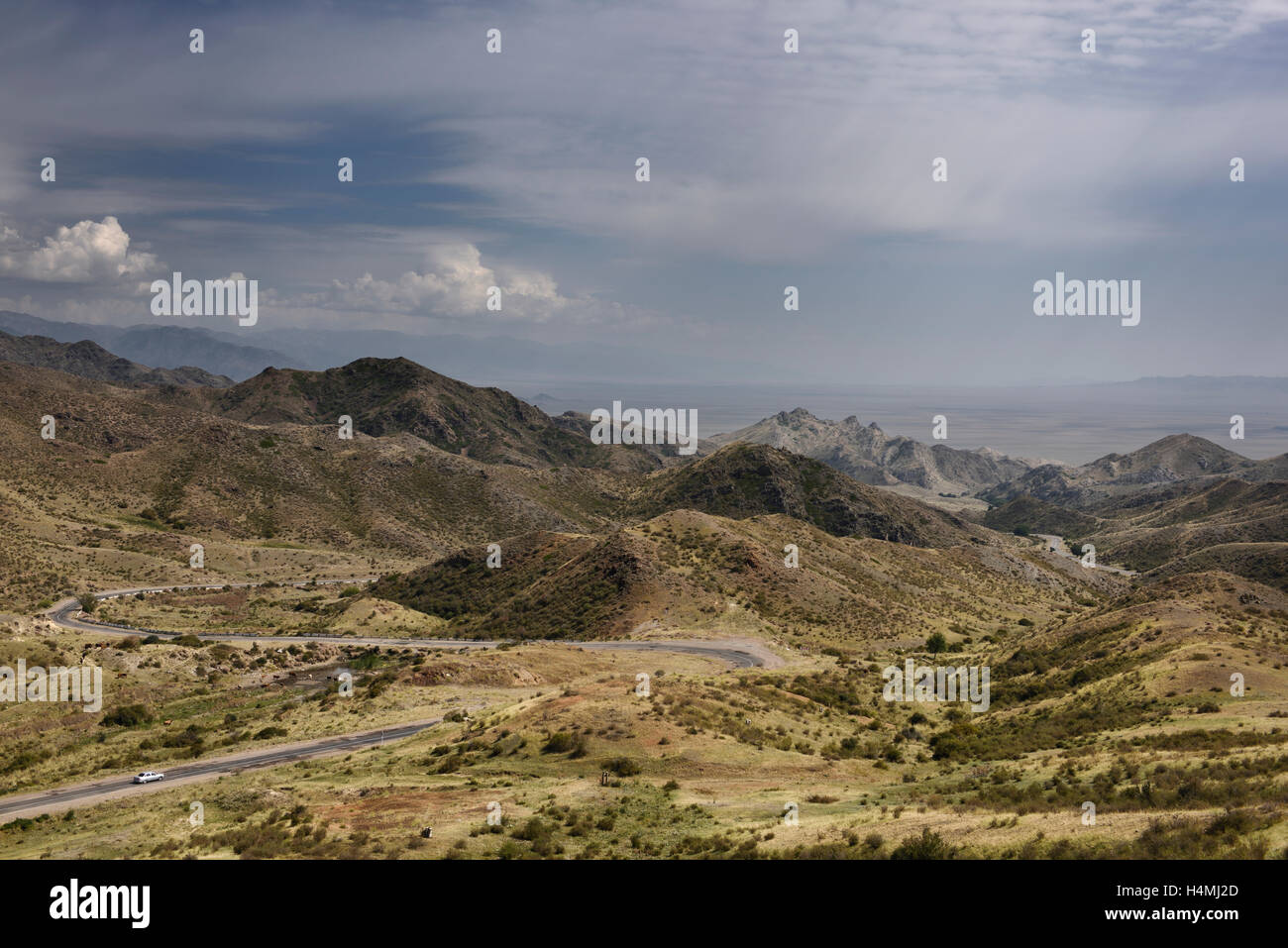 Highway A353 winding through Altyn Emel mountains to the National Park ...