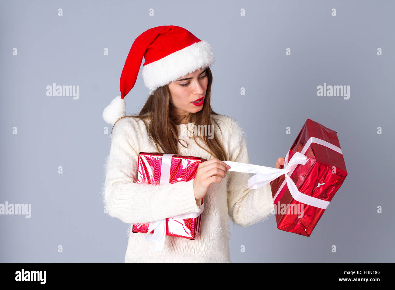 Woman opening gift beautiful hi-res stock photography and images - Alamy