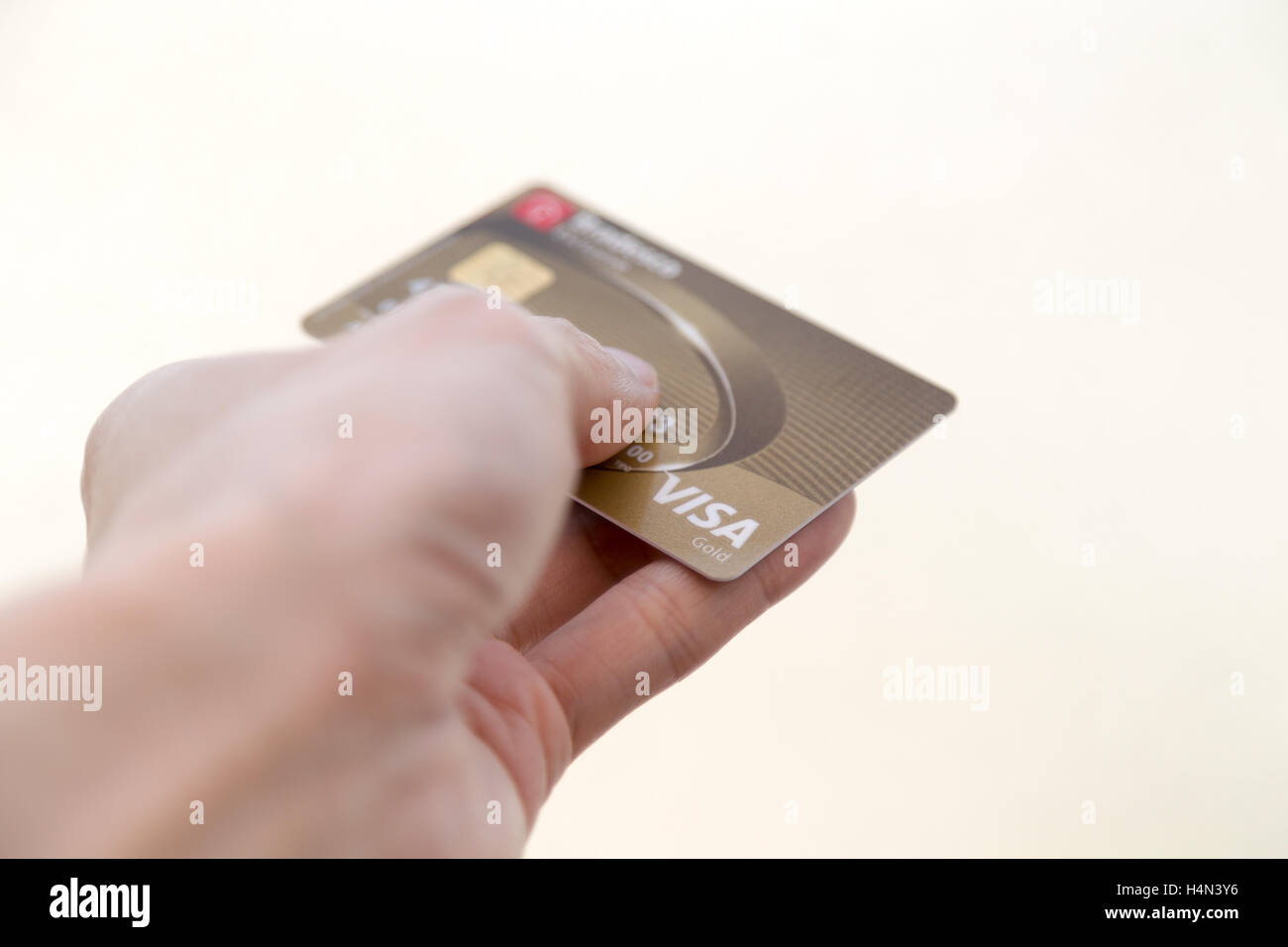 Hand holding a debit, credit card Stock Photo - Alamy