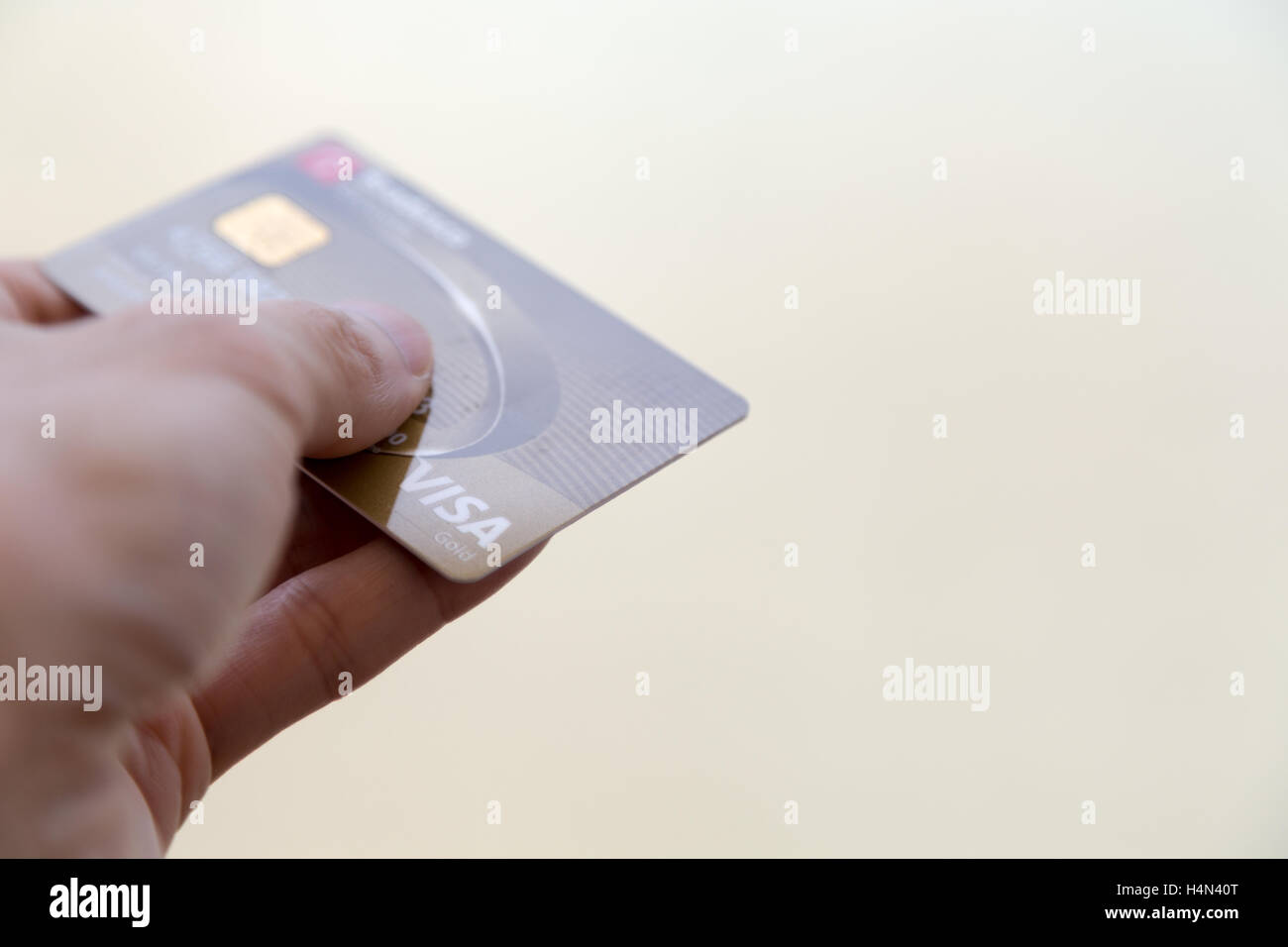Hand holding a debit, credit card Stock Photo - Alamy
