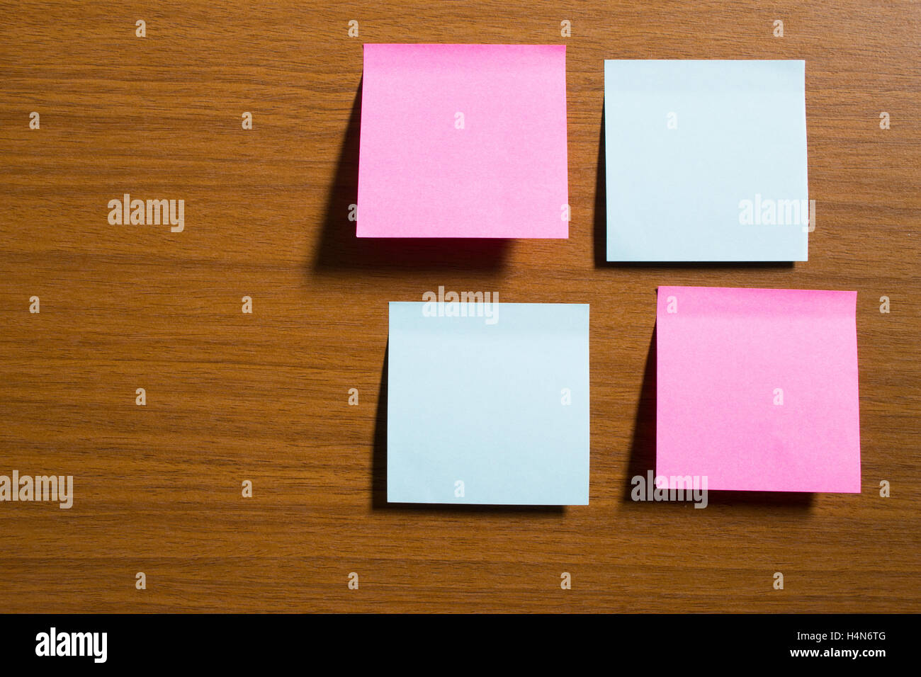 Sticky notes stick on wooden texture Stock Photo - Alamy