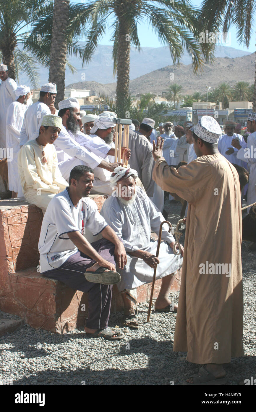 The cattle market in Nizwa, Oman. Local tribesmen trade cattle and ...