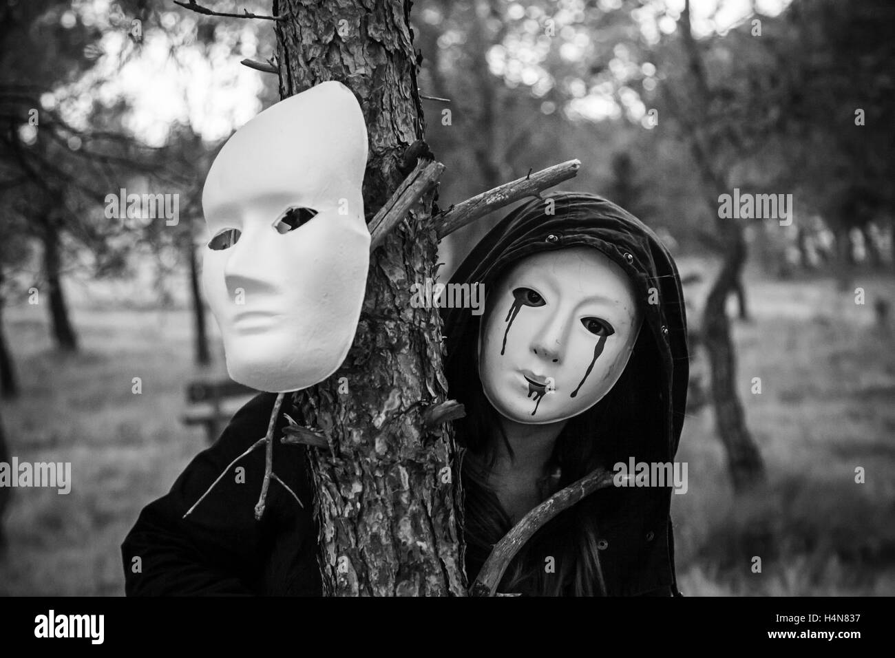 Woman with ski masks and violent hooded mask Stock Photo - Alamy
