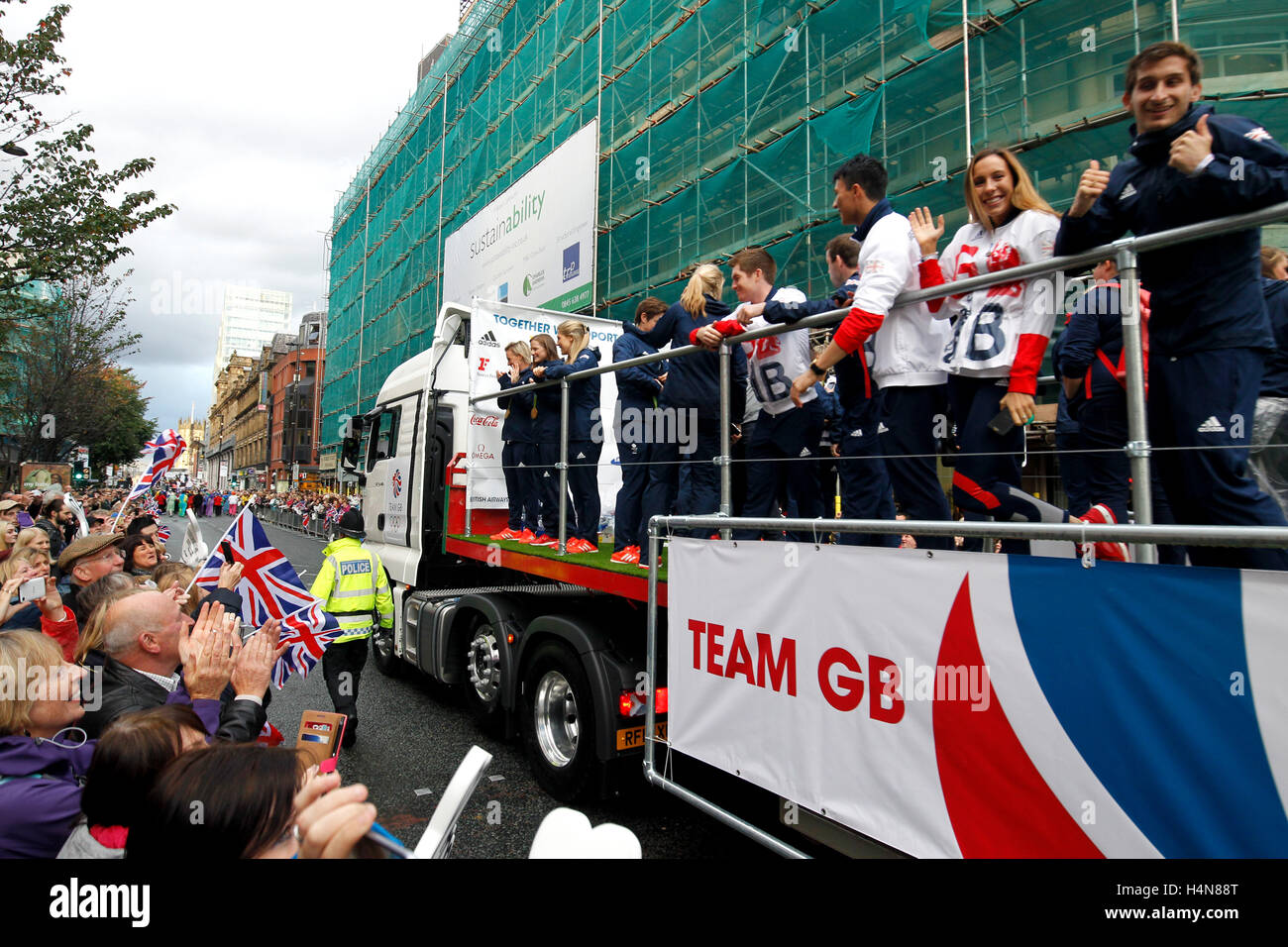 The Crowd show their support as a float passes by during the Olympic ...