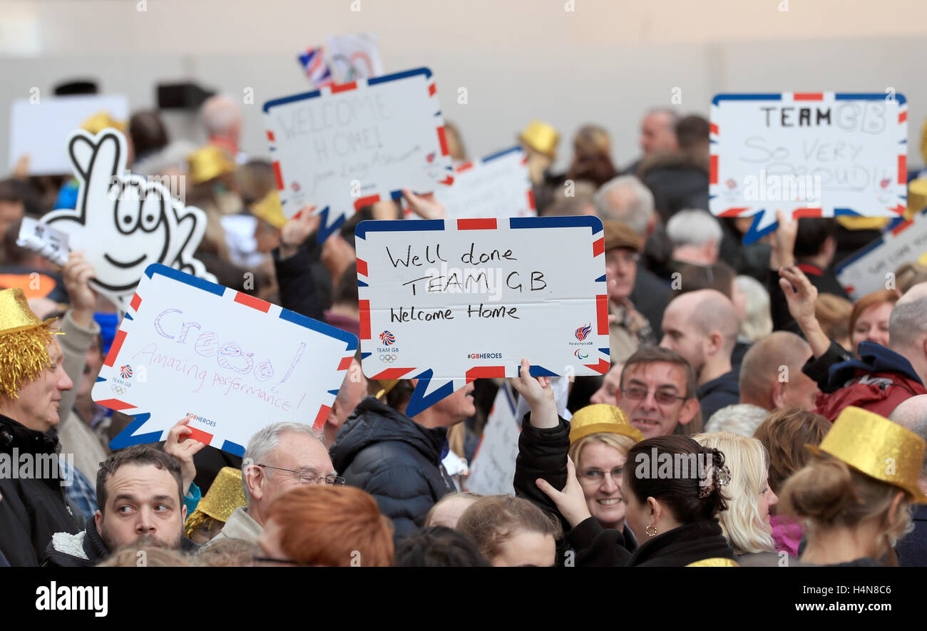 Members of the crowd hold up signs during the Olympic and Paralympic ...