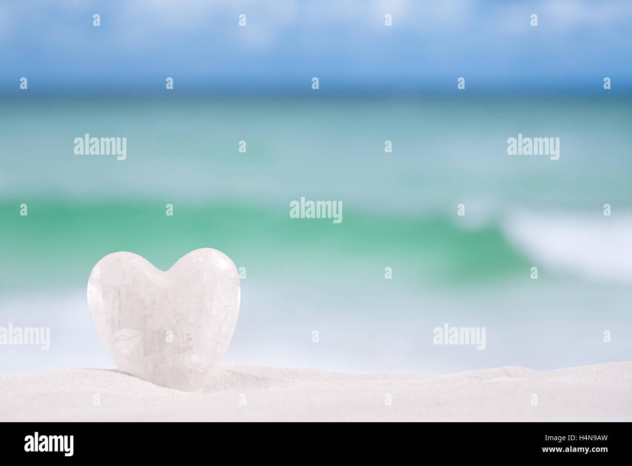 Crystal heart on sand hi-res stock photography and images - Alamy