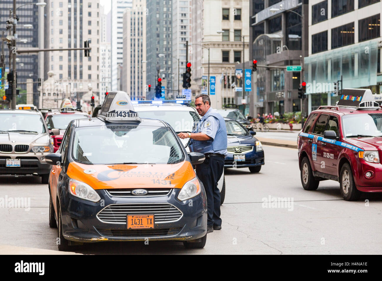Chicago Cop and Taxi in street Stock Photo - Alamy
