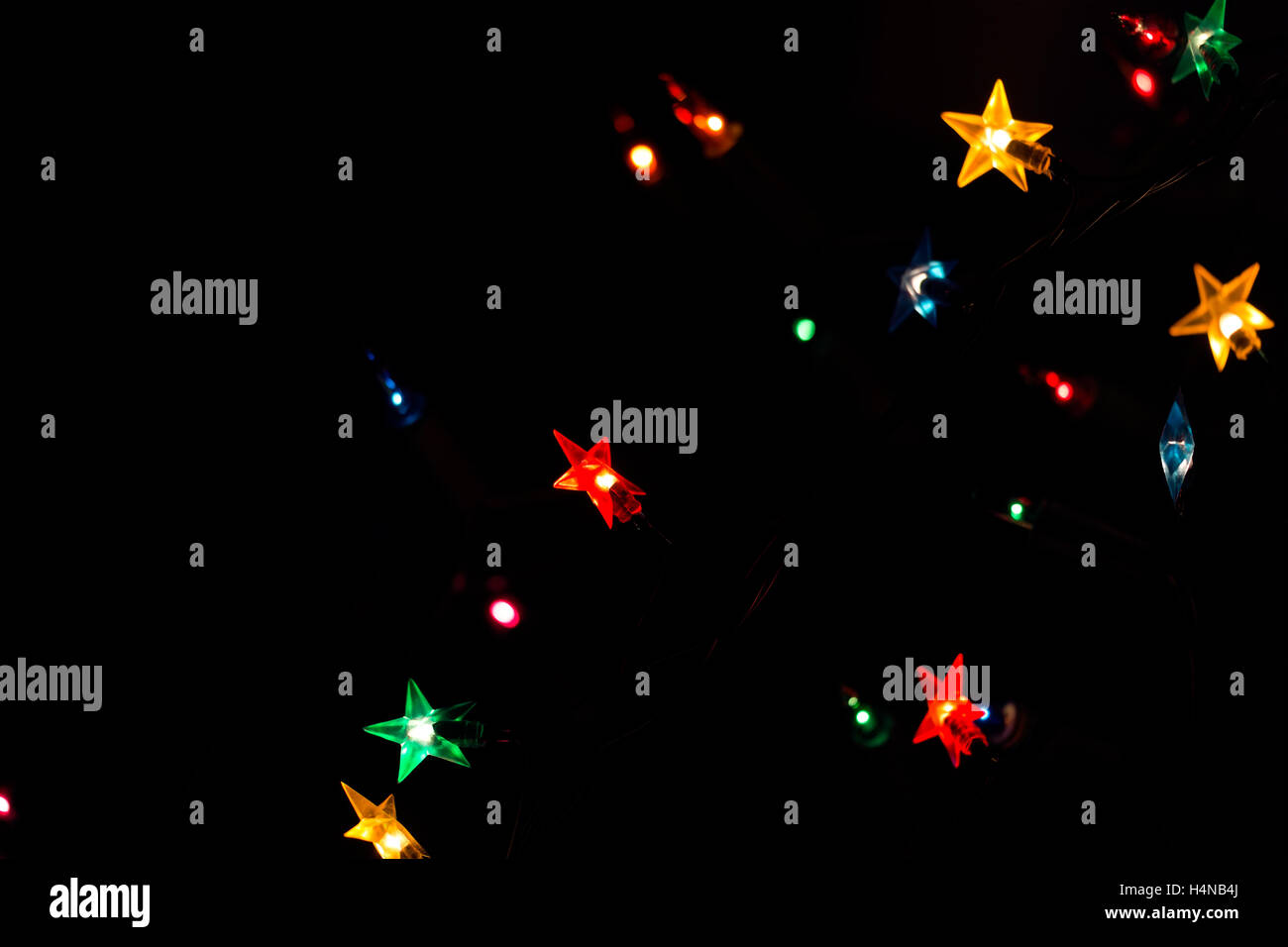 Christmas holiday background of sparkling colorful star lights Stock ...