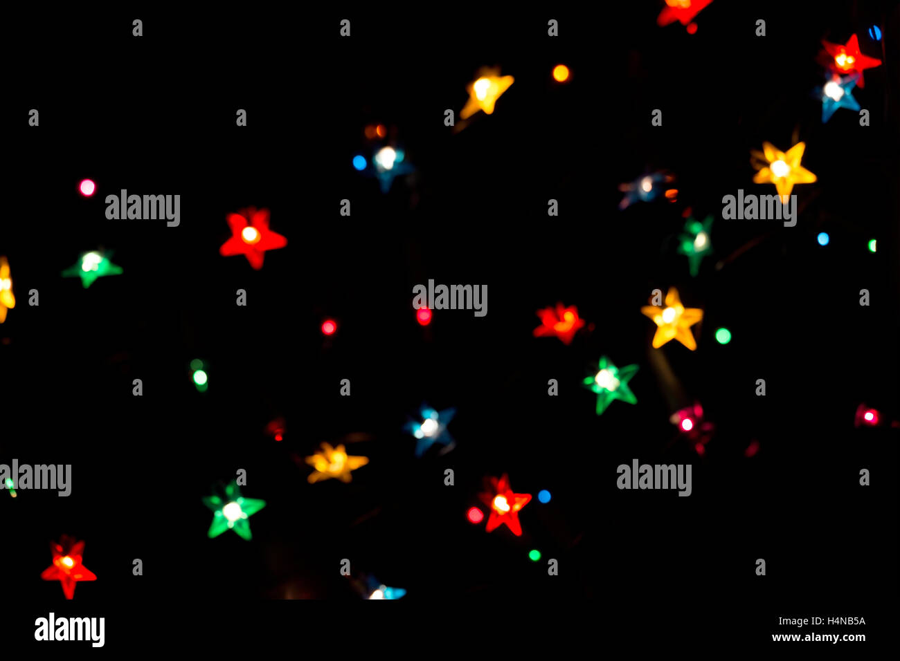 Abstract holiday background with colorful blurred star lights Stock ...