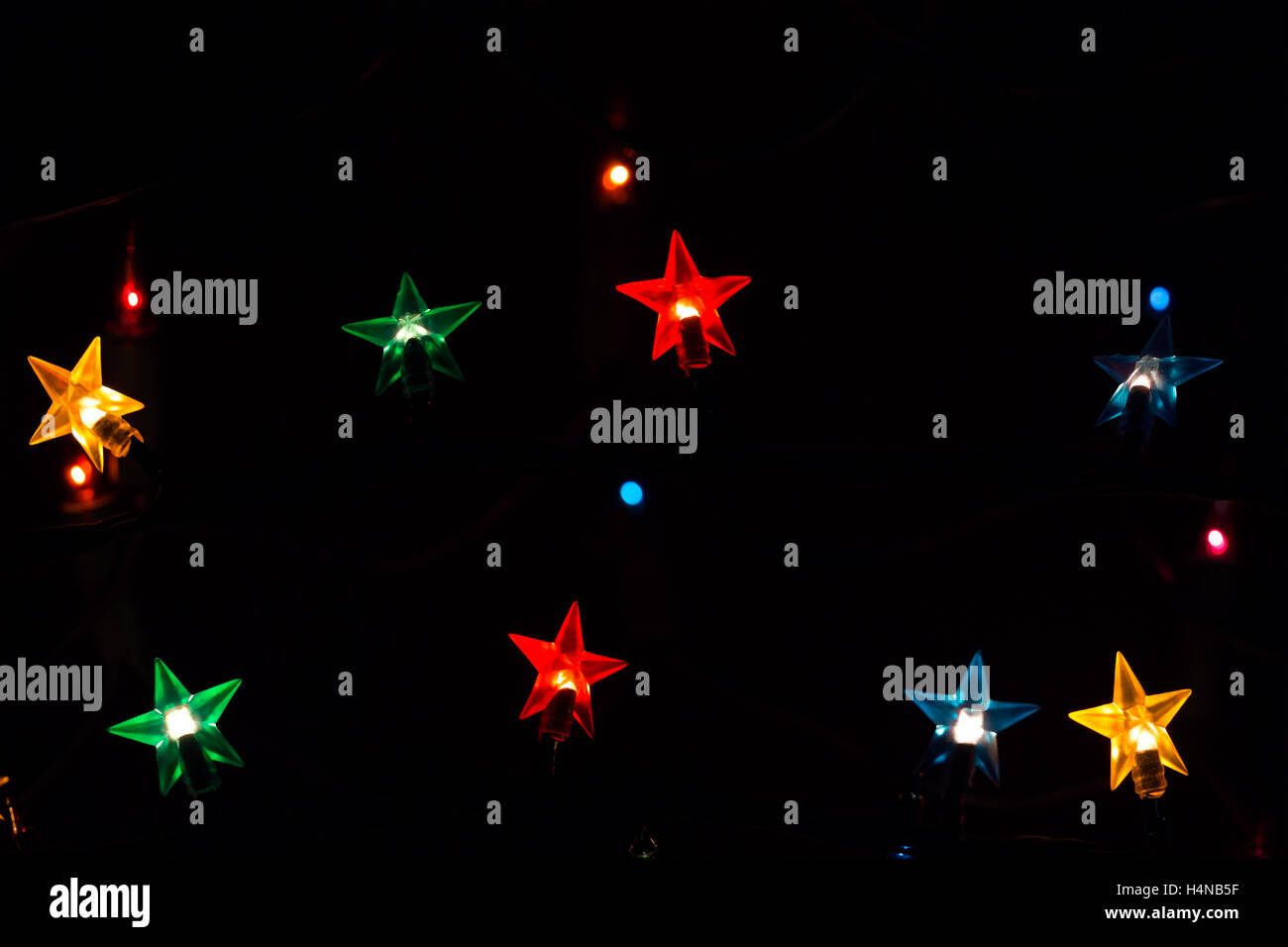 Christmas holiday background of sparkling colorful star lights Stock ...
