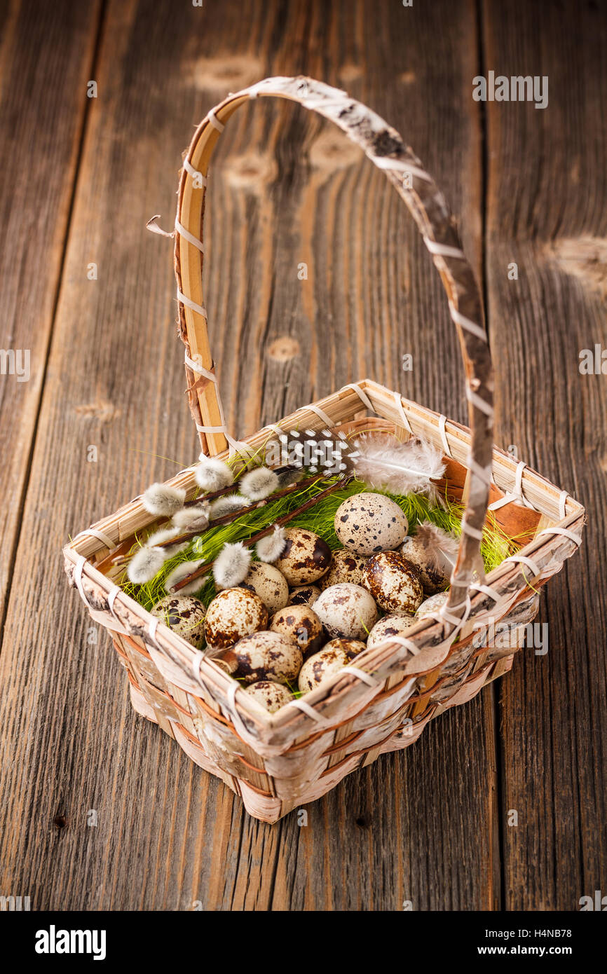 Quail eggs in a basket on rustic wooden background Stock Photo - Alamy